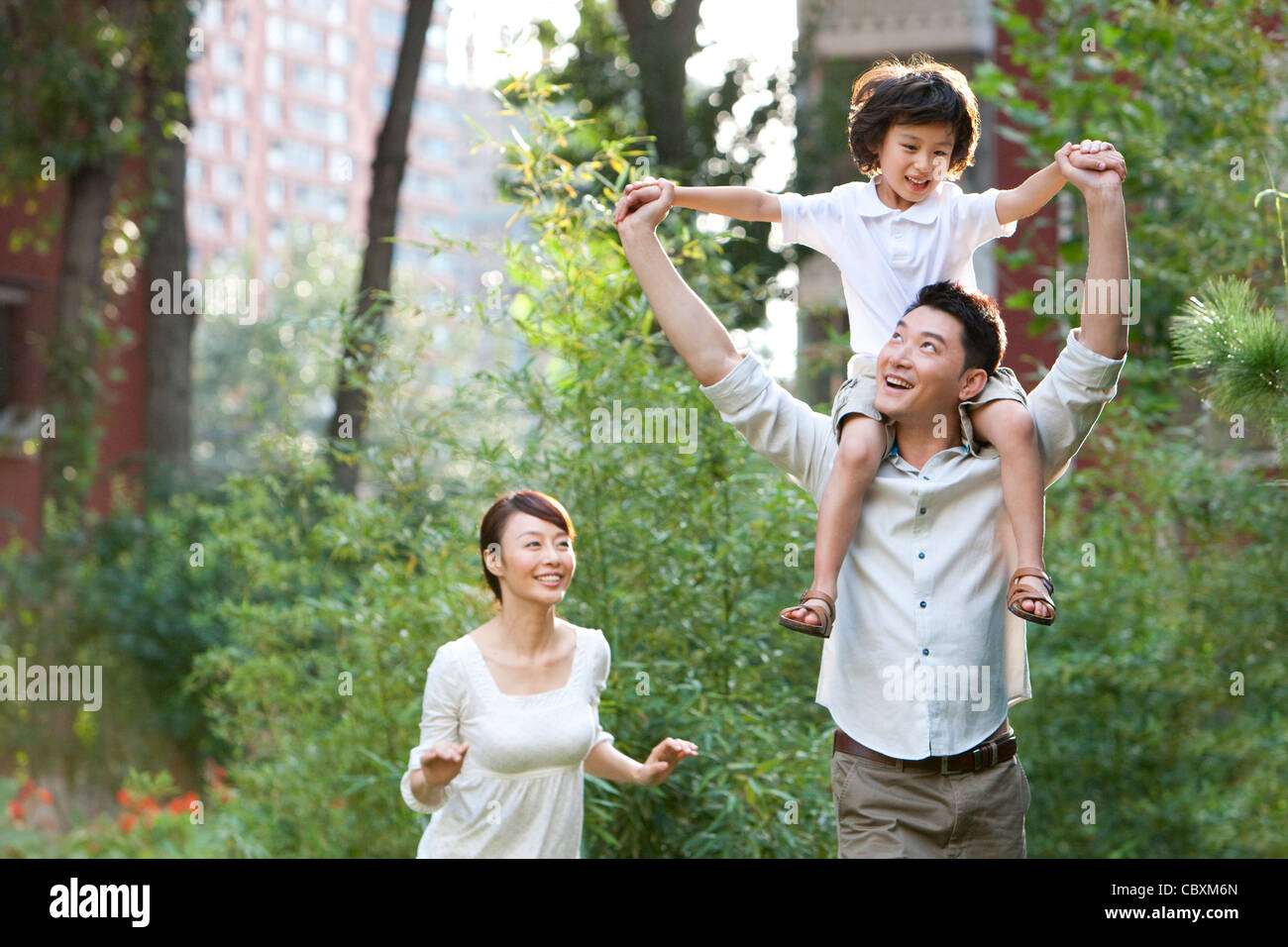 Family having fun in a common community Stock Photo - Alamy