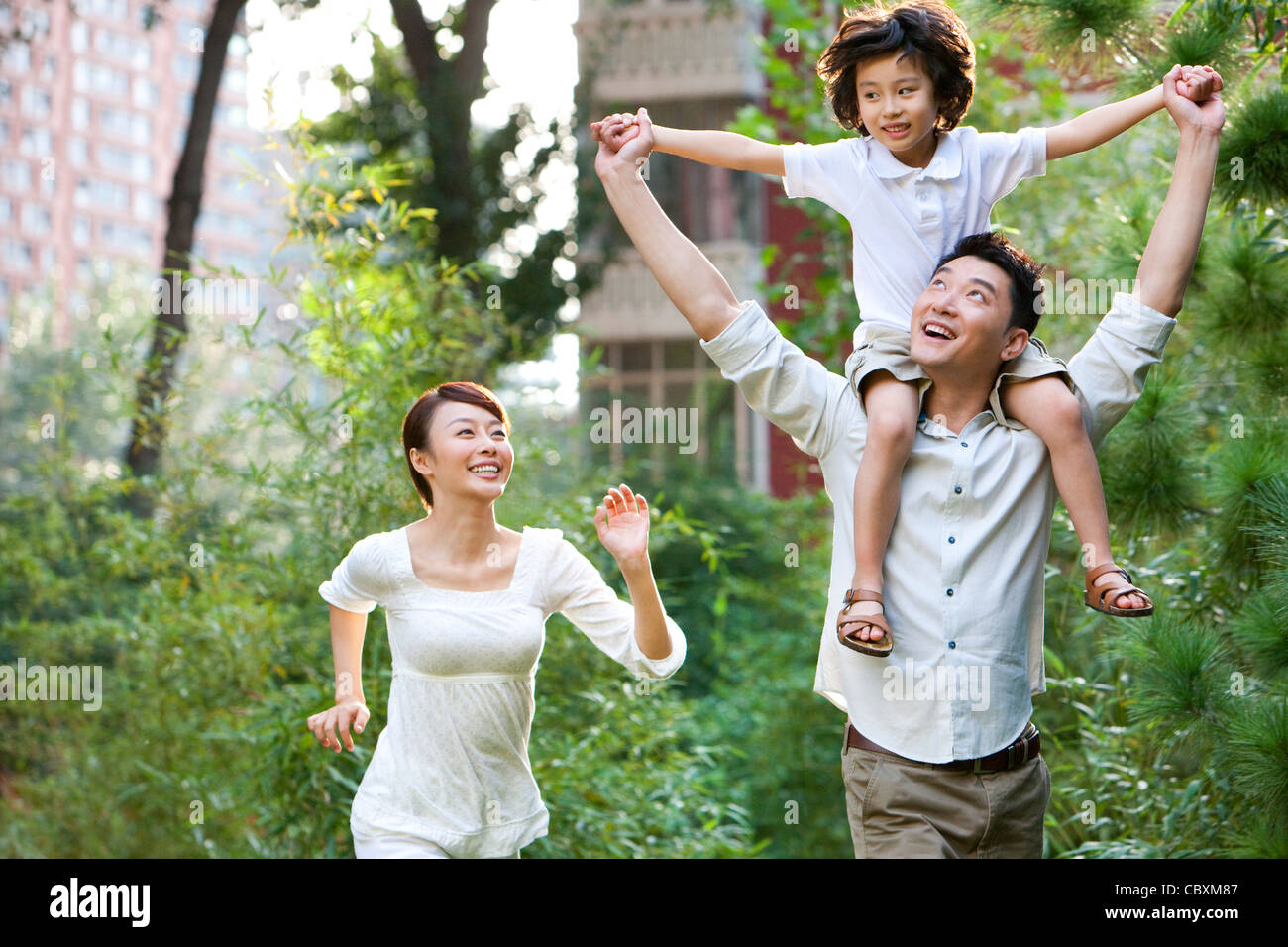 Family having fun in a common community Stock Photo - Alamy