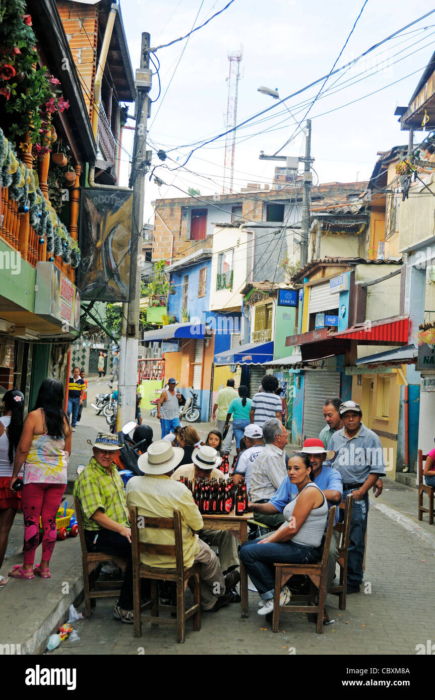 People sitting at a bar in the street, Comuna 13, Medellin, Antioquia ...