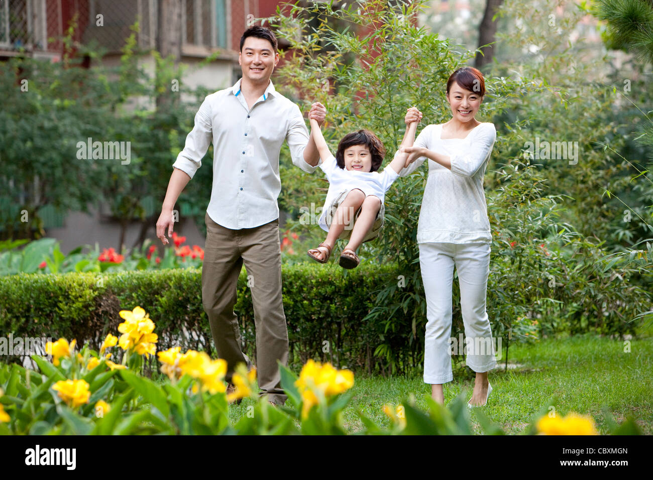 Family having fun in a common community Stock Photo - Alamy