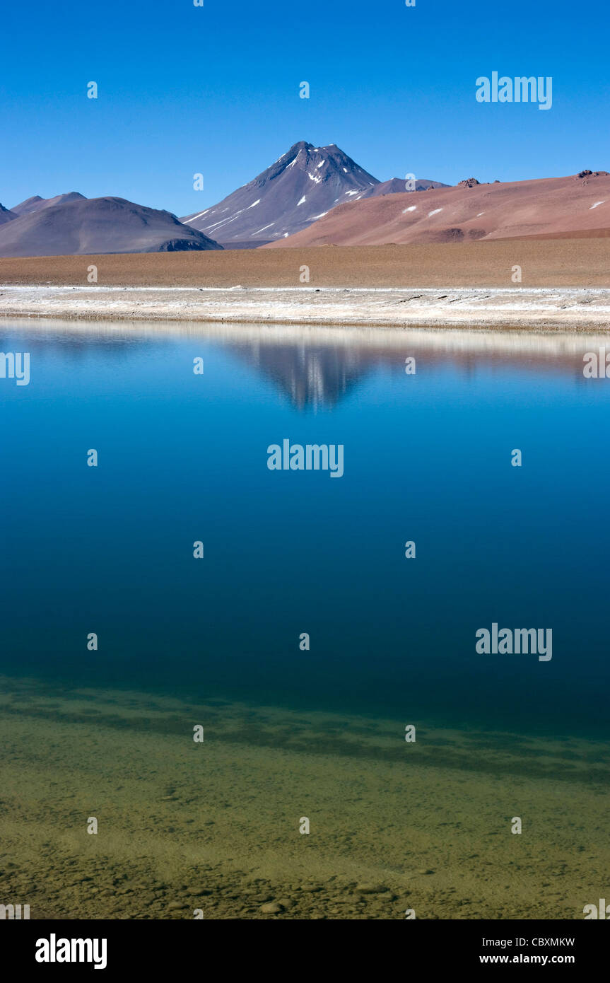 Chile. Atacama desert. Quepiaco lake and the Pili volcano Stock Photo ...