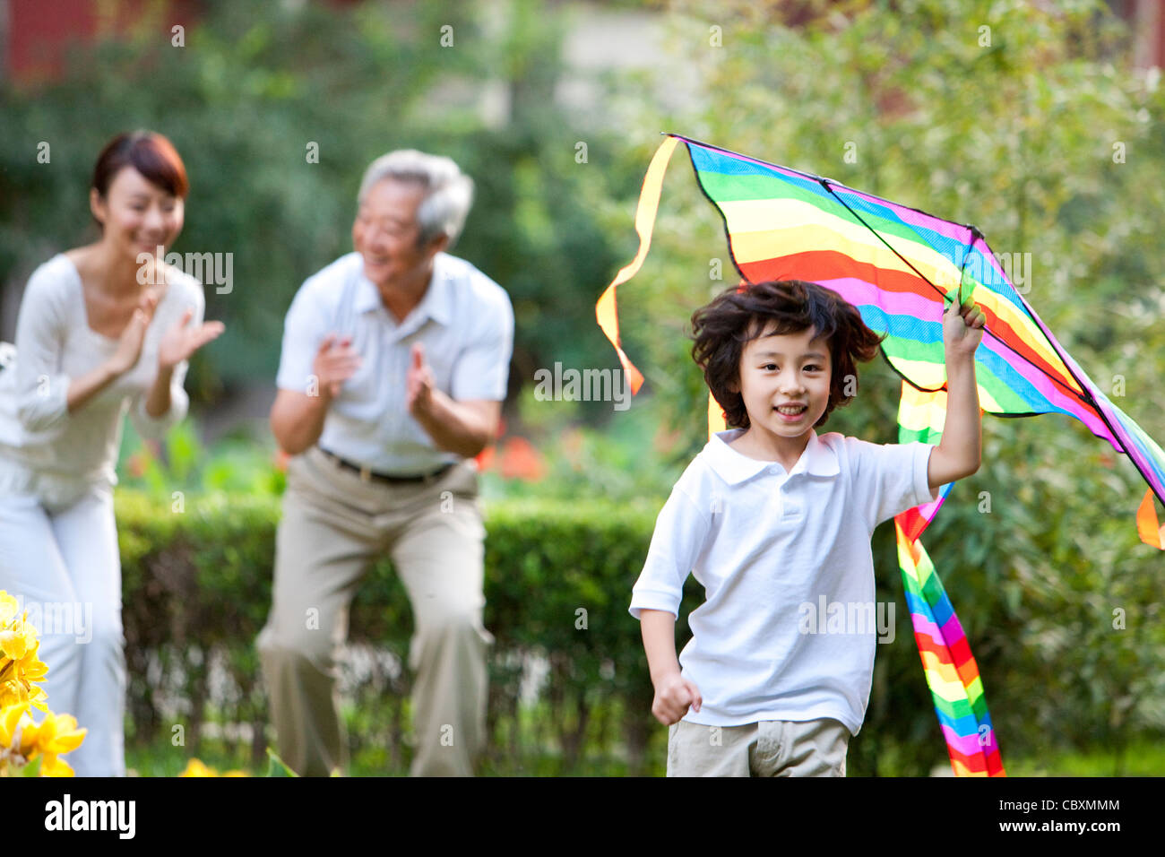 Family having fun in a common community Stock Photo - Alamy
