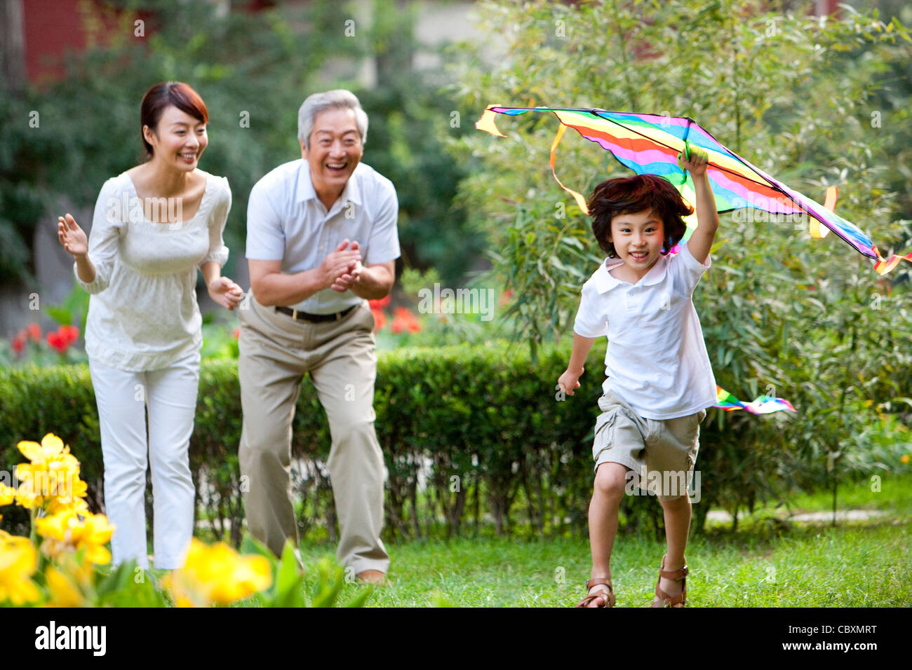 Family having fun in a common community Stock Photo - Alamy