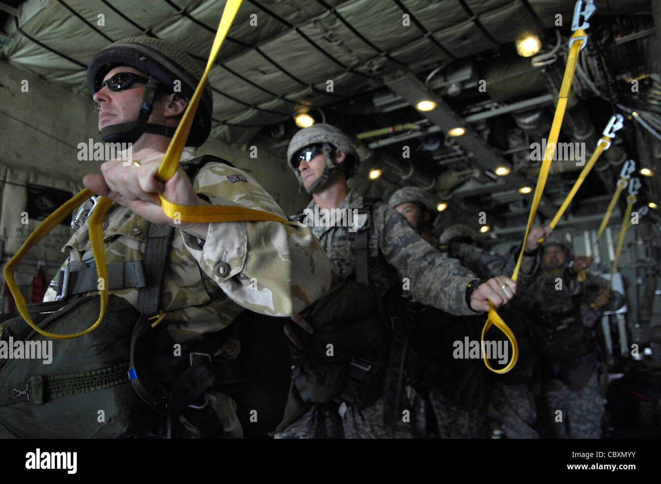 Sqn. Ldr. Tim Harrison waits to jump out of a Marine C-130 Hercules as ...