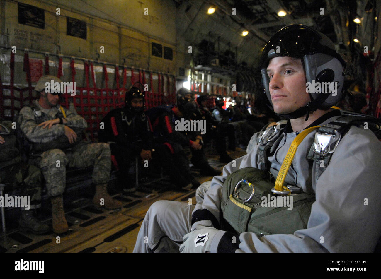 Staff Sgt. Brian Daubert sits inside a Marine C-130 as it flies over ...