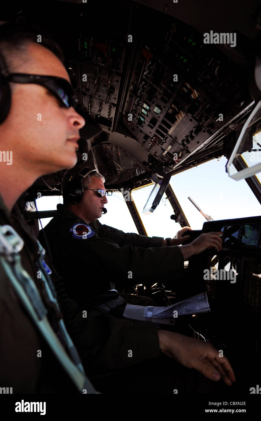 Capt. Shane Devlin and Maj. John Wagner fly a WC-130J "Hurricane Hunter ...
