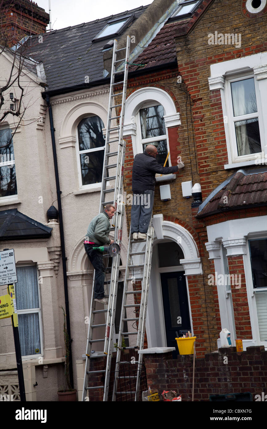 Workmen on Ladders on Exterior of London Home Stock Photo - Alamy