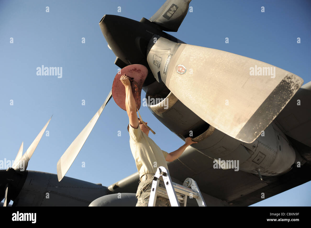 Staff. Sgt. Eric Jancaitis removes an engine intake plug May 20 in ...