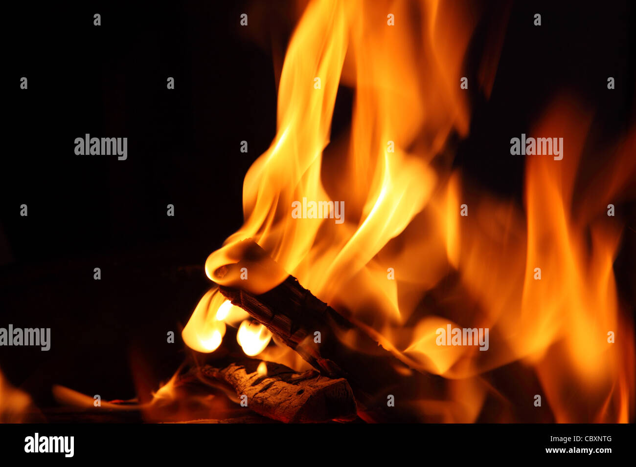 Close-up of fire and flames on a black background Stock Photo - Alamy