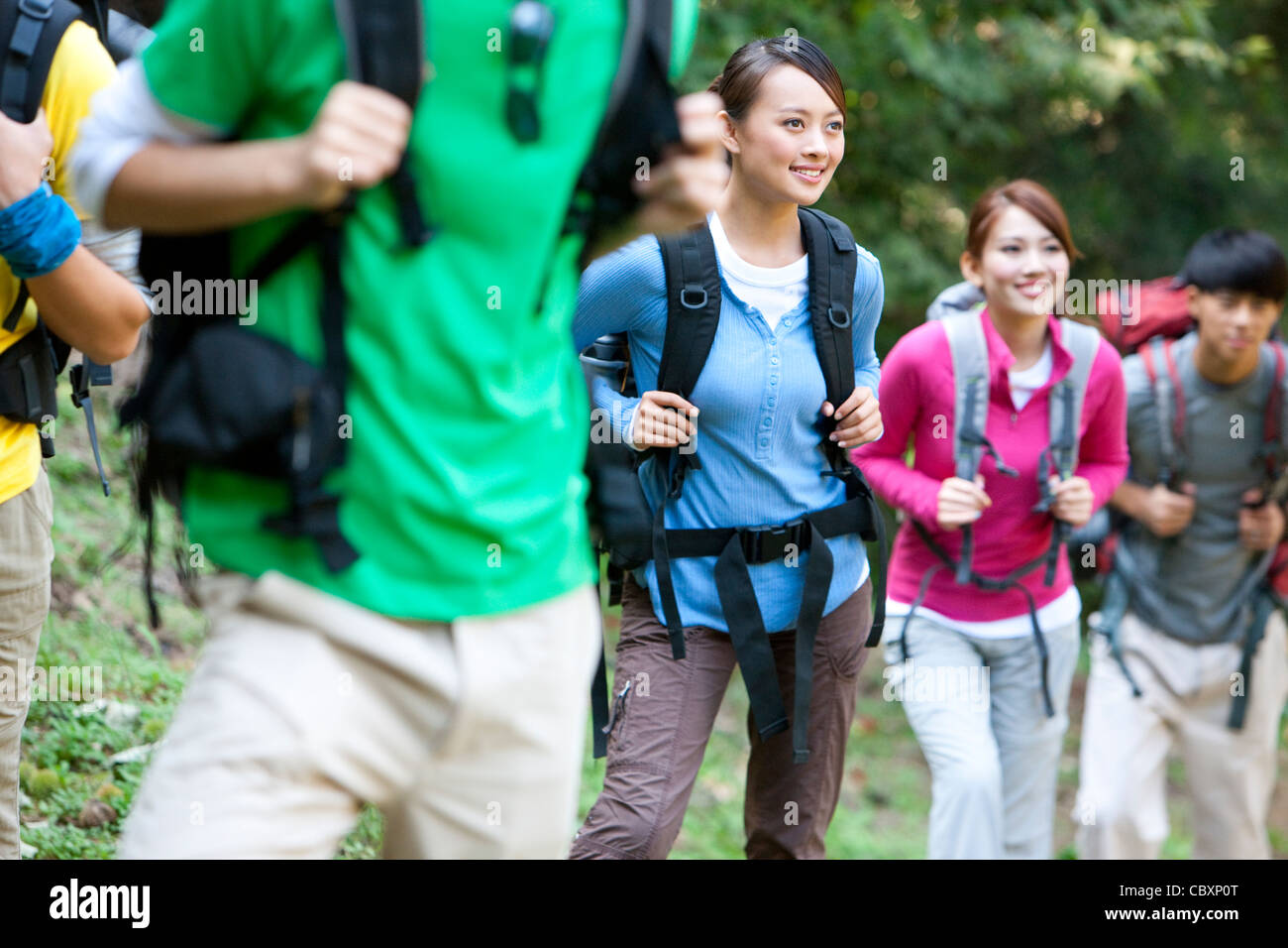 Young people go hiking in mountain Stock Photo - Alamy