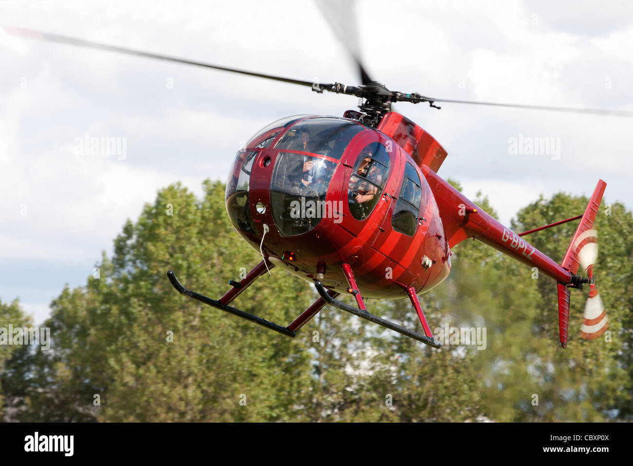 Hughes 369HS 500 G-PBLZ landing at Breighton Airfield Stock Photo - Alamy