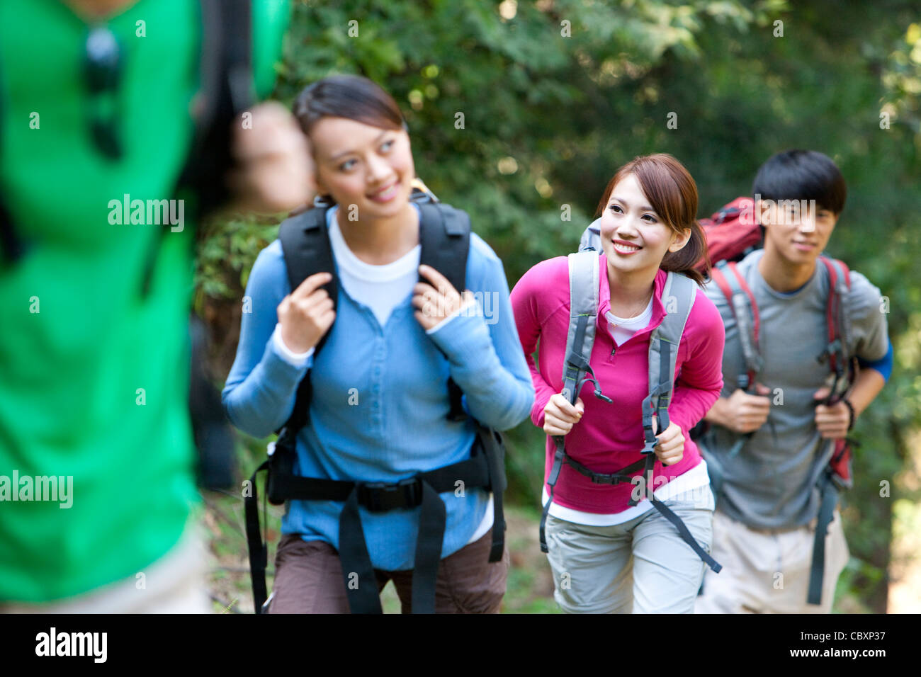 Young people go hiking in mountain Stock Photo - Alamy