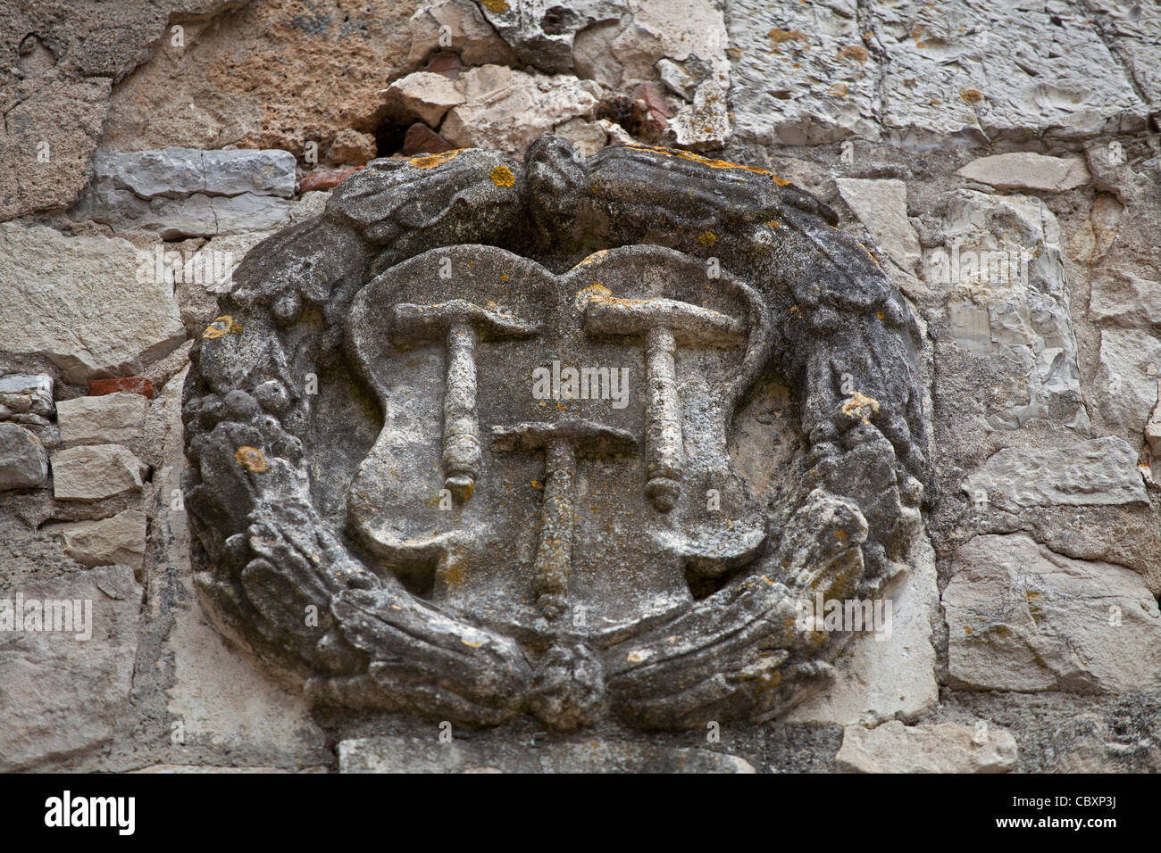 Martel's logo of the Three hammers carved in stone France Stock Photo ...