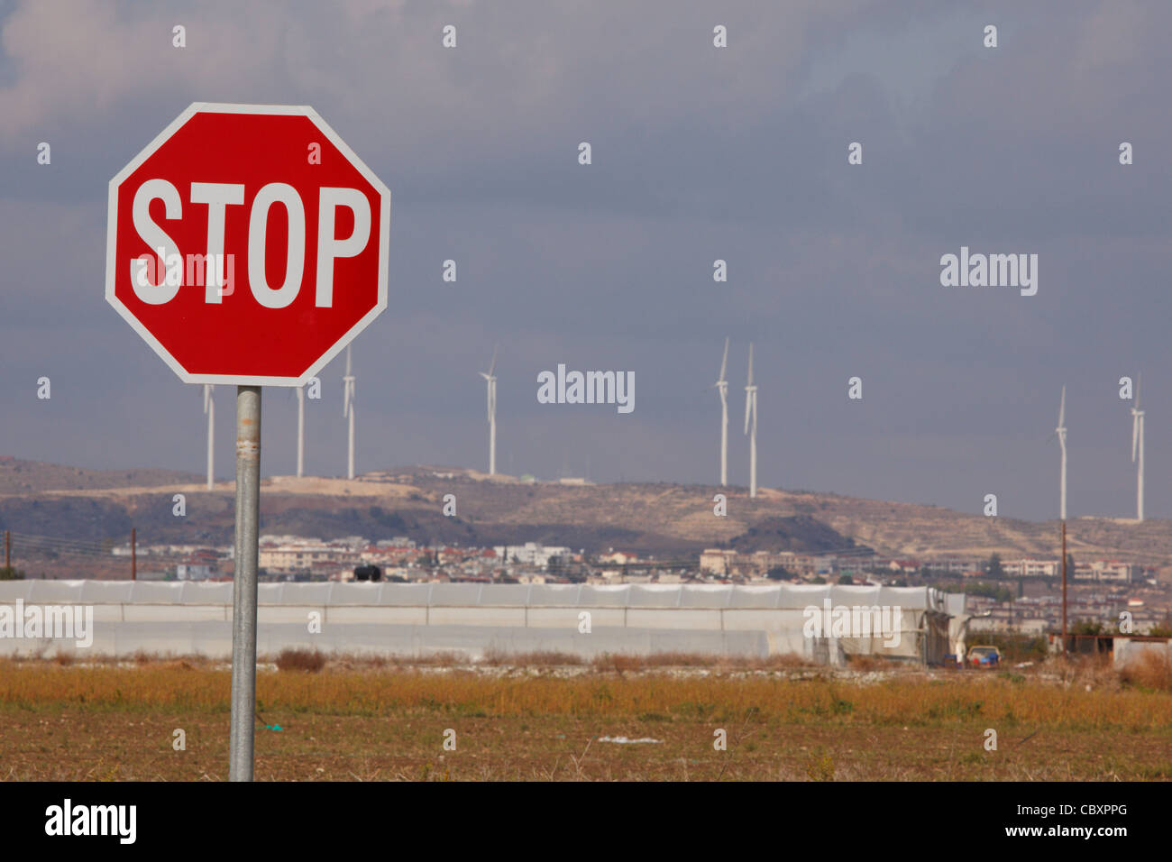 Stop sign in front of wind farm, Cyprus Stock Photo - Alamy