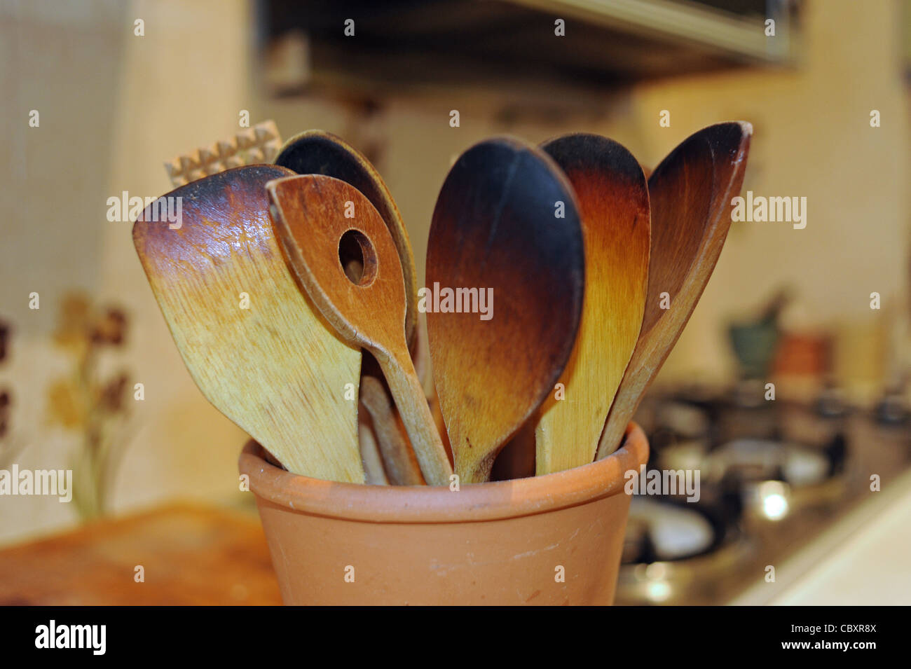 Chefs wooden spoons in domestic kitchen container pot Stock Photo - Alamy