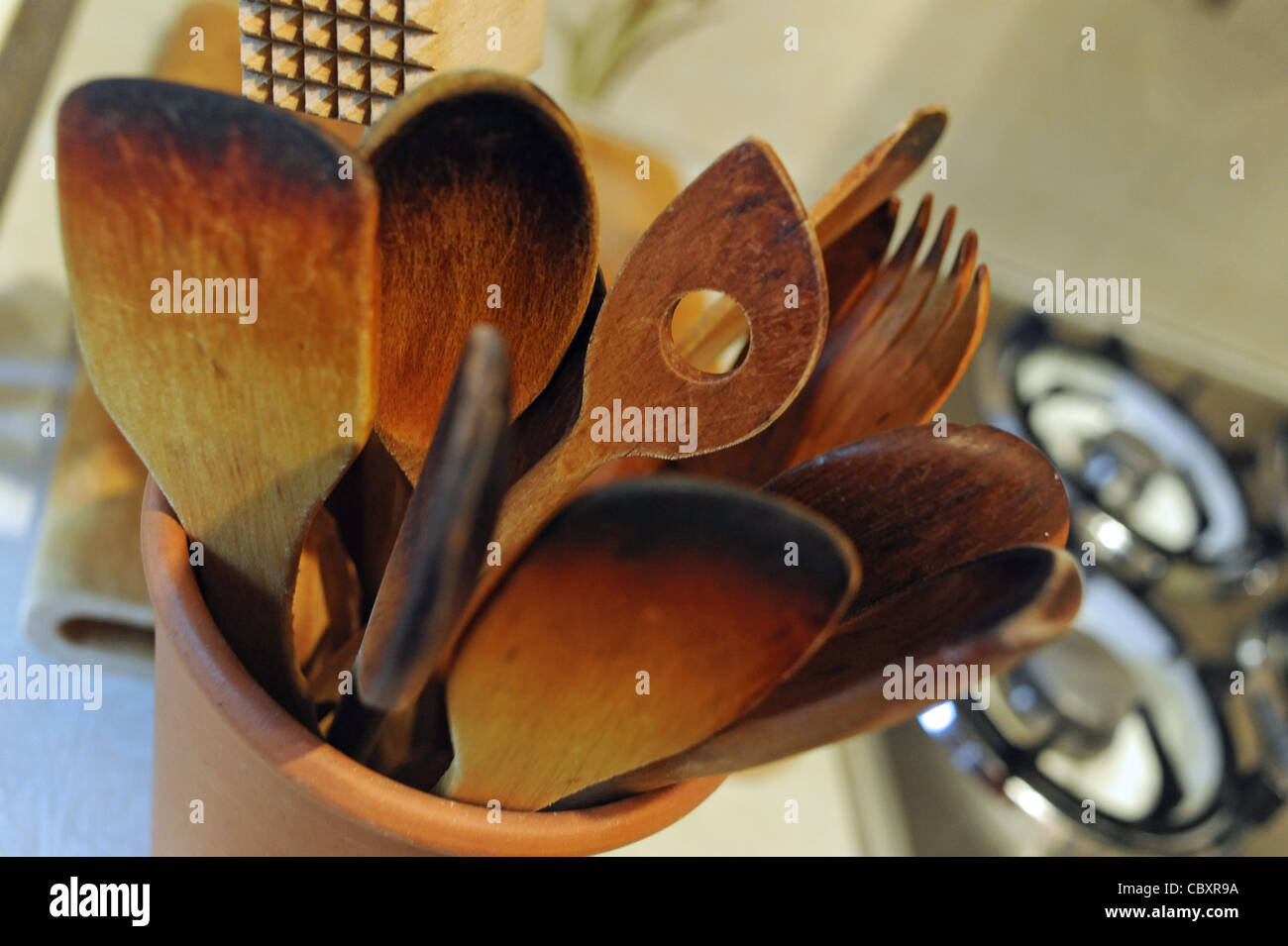 Chefs wooden spoons in domestic kitchen container pot Stock Photo - Alamy