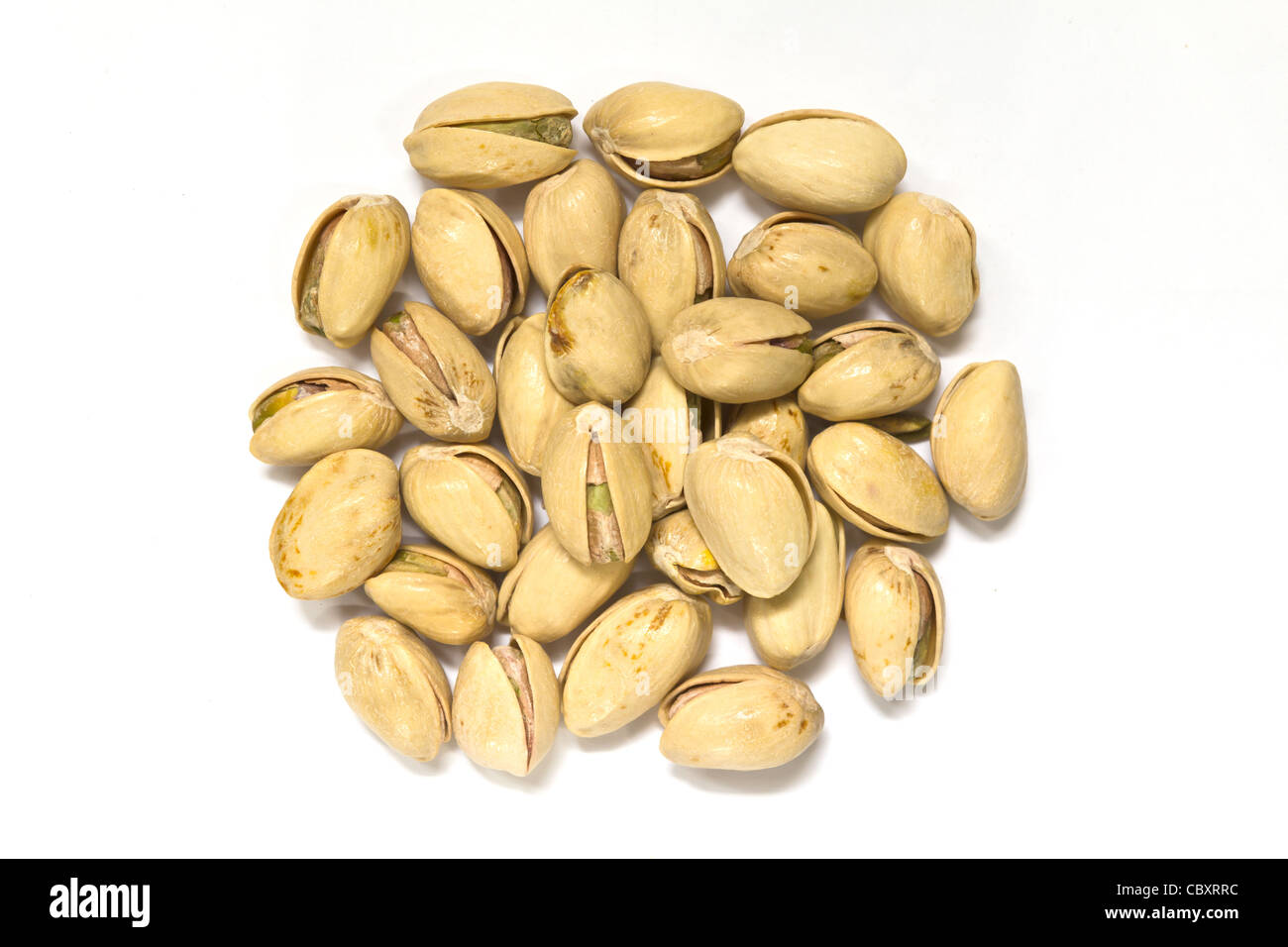 closeup image of pistachios on white background Stock Photo - Alamy