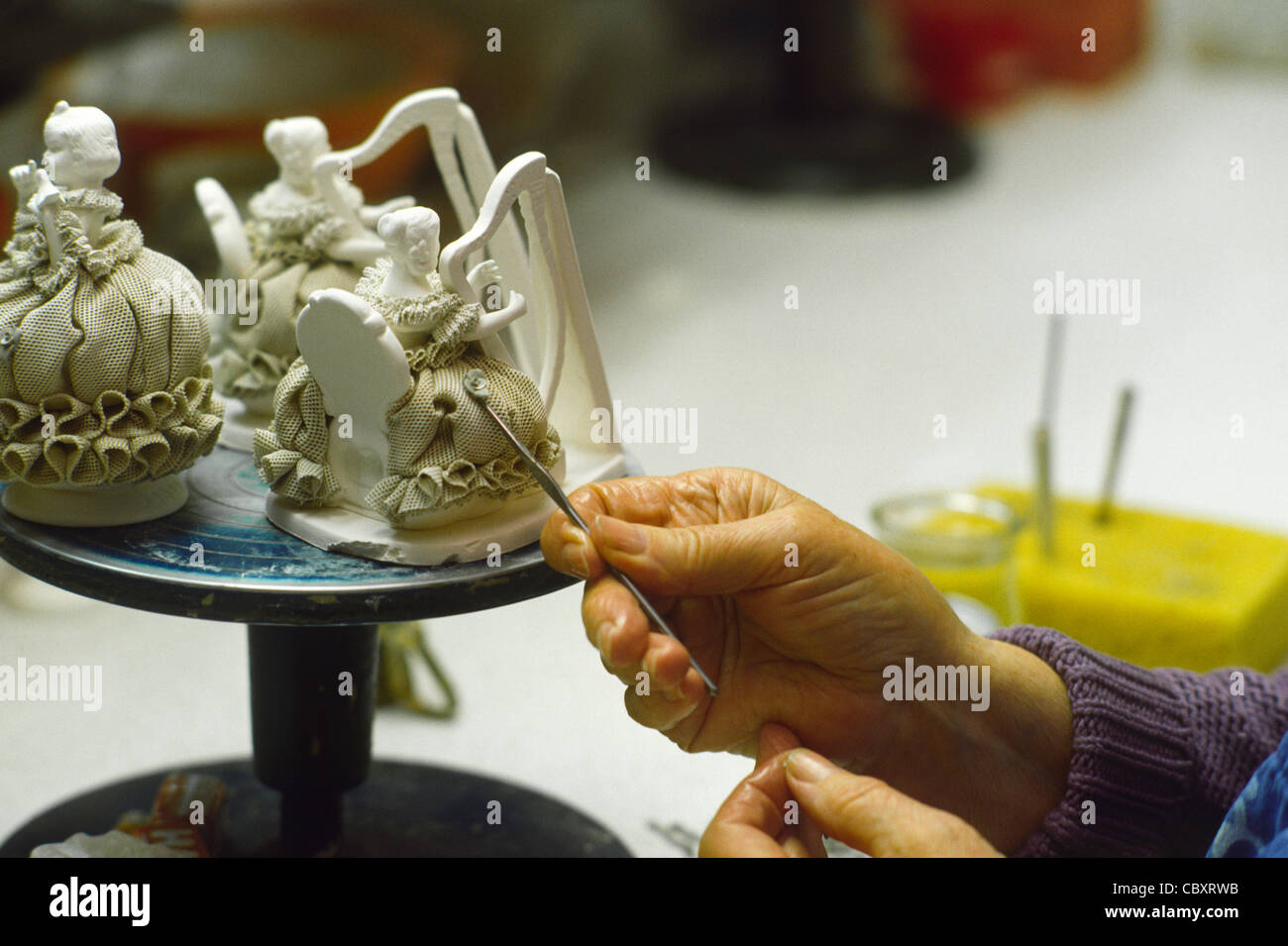 Artisan working on porcelain figure at Irish Dresden factory (closed ...
