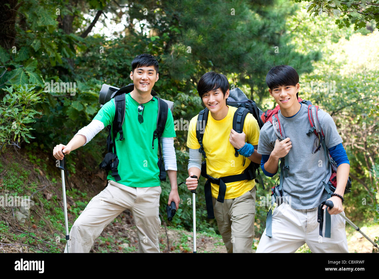 Young people go hiking in mountain Stock Photo - Alamy