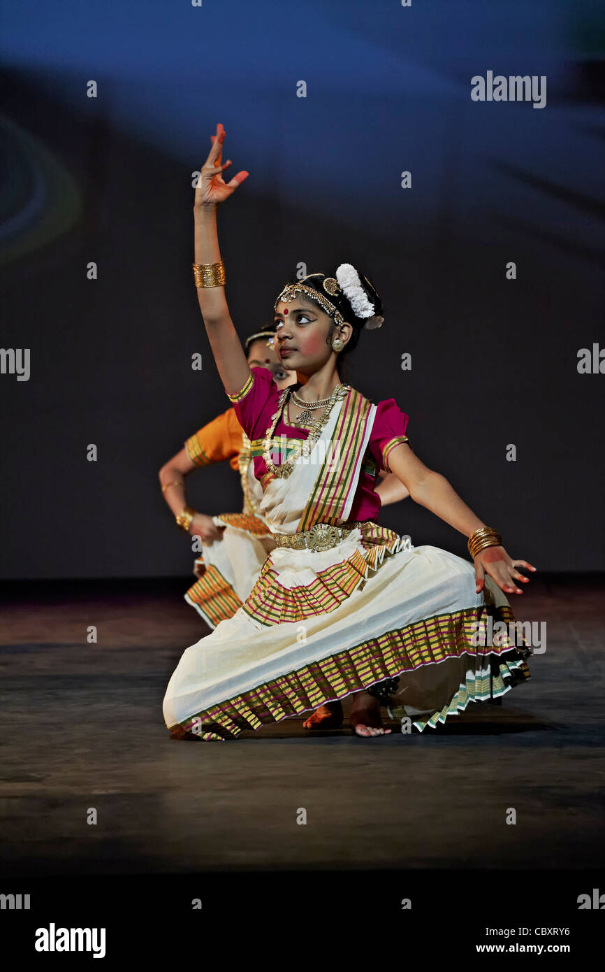 Asian Indian dancer performing on stage wearing traditional costume ...