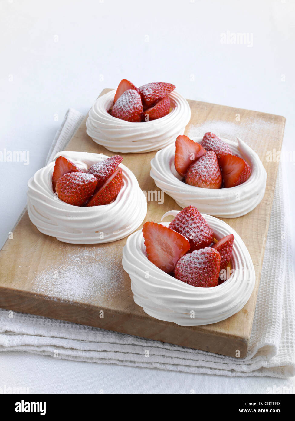 Strawberry meringue nests Stock Photo - Alamy