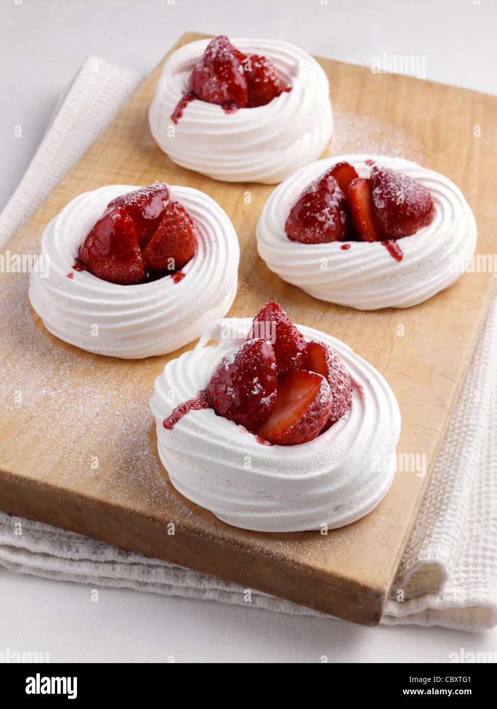 Strawberry meringue nests Stock Photo - Alamy