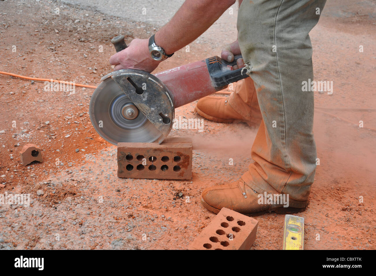 Stonemason cutting brick with diamond tipped disc Stock Photo - Alamy