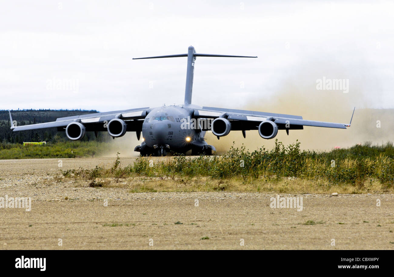 A C-17 Globemaster III executes a semiprepared runway operation landing ...