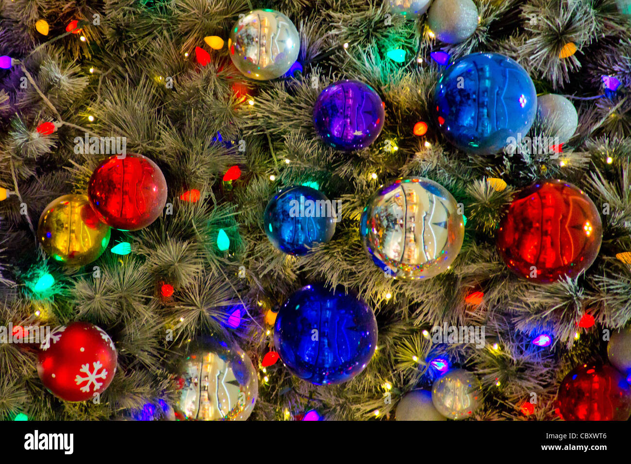 Christmas ornaments and lights on tree Stock Photo - Alamy