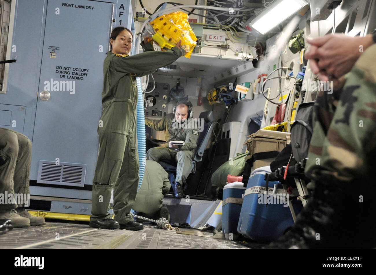 Tech. Sgt. Kimberly Kido demonstrates the proper use of the emergency ...