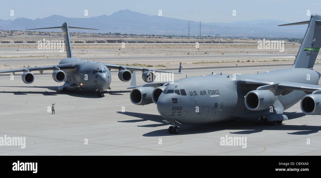 C-17 Globemasters, like the ones shown here at Nellis Air Force Base ...