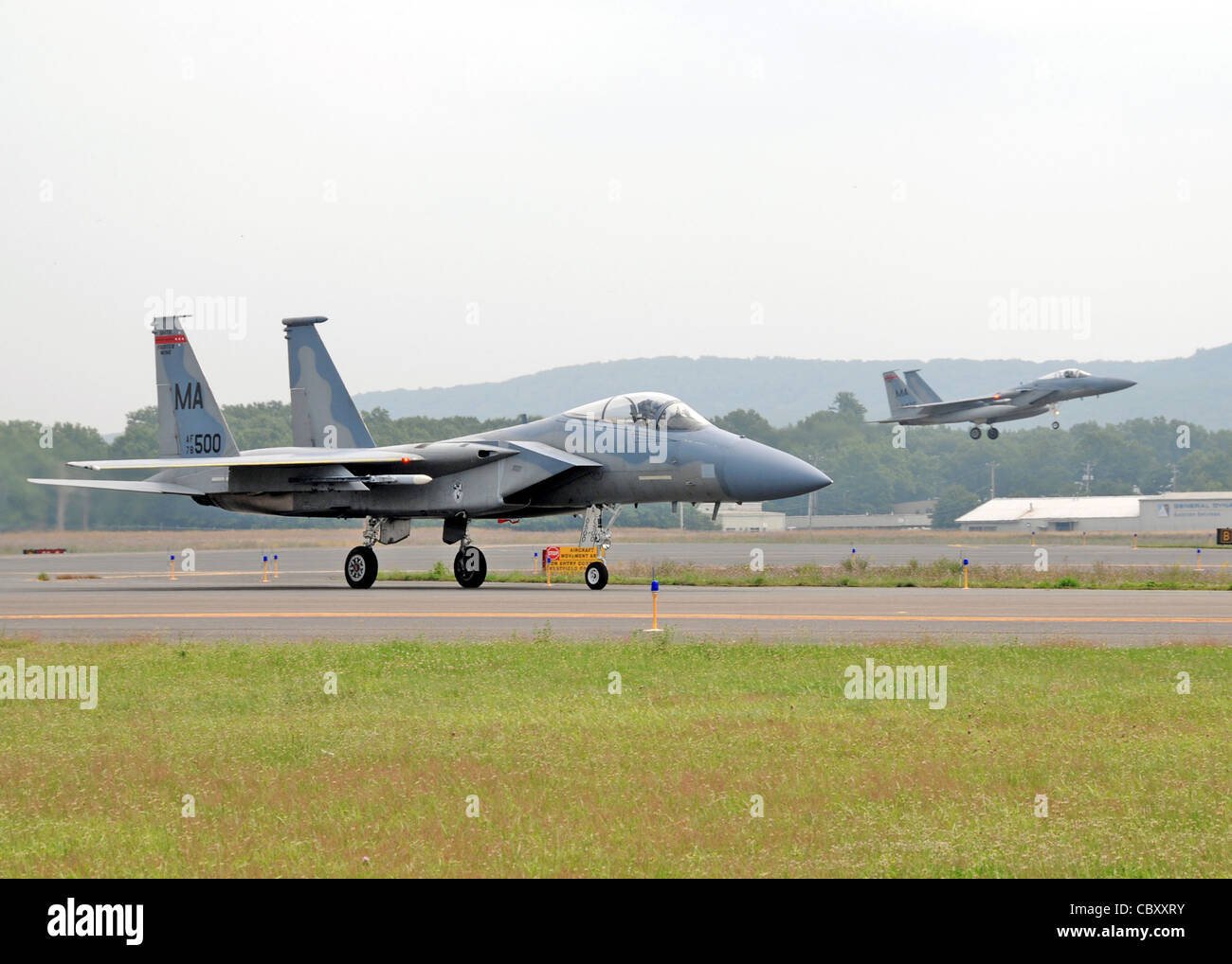 F-15 Eagles from the Massachusetts Air National Guard's 104th Fighter Wing fly training missions ...