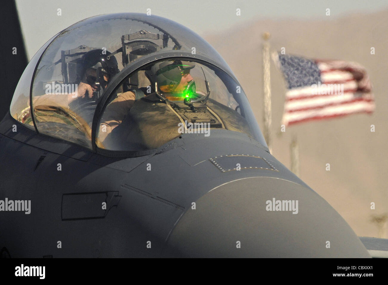 An F-15E Strike Eagle pilot and weapon system operator from the 336th ...