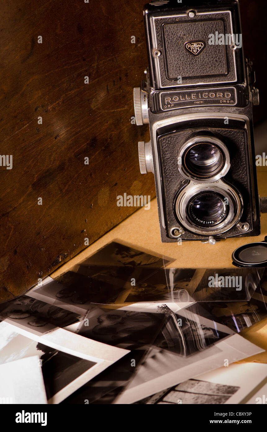 Vintage camera with negatives Stock Photo - Alamy