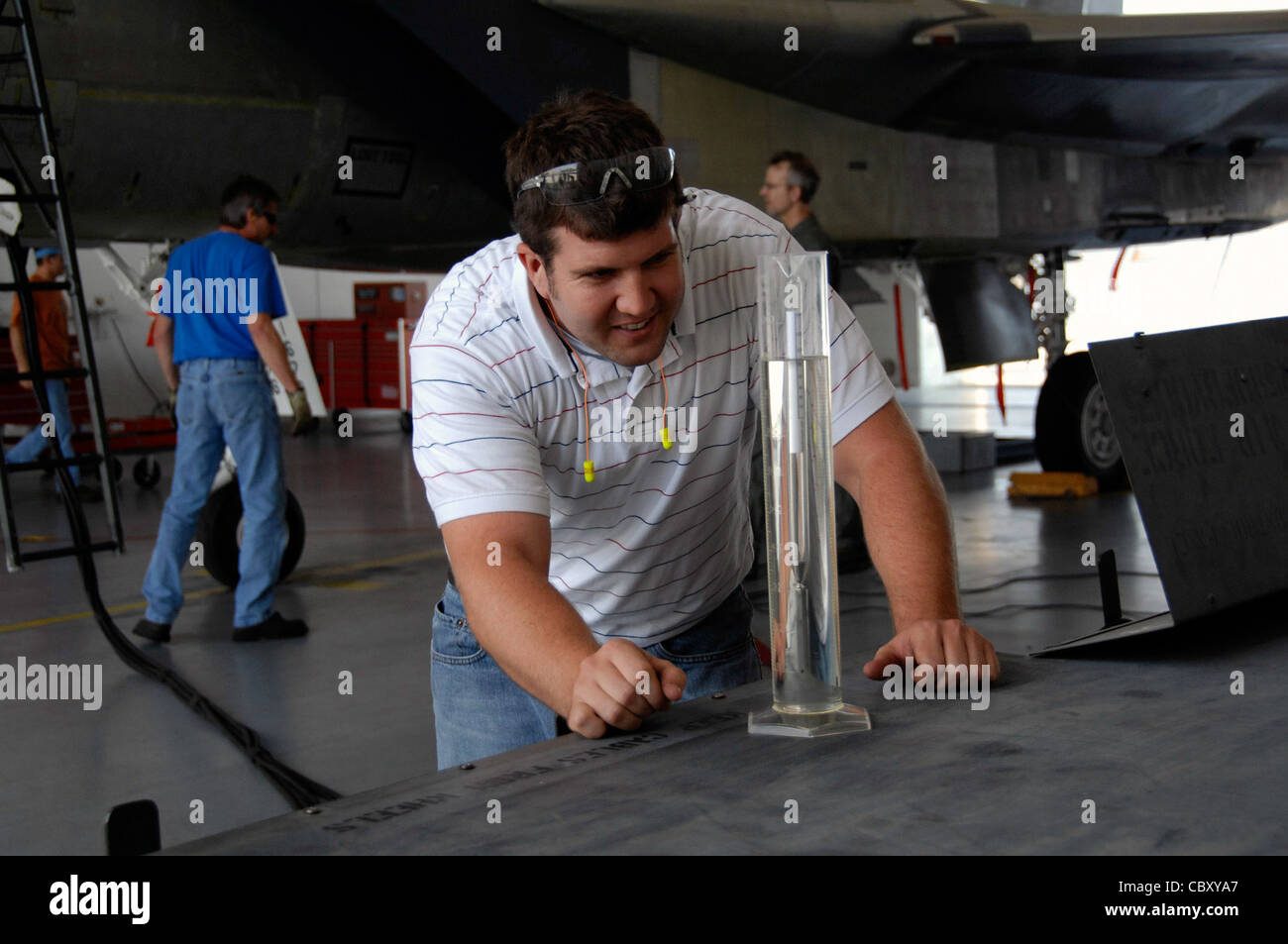 Ryan Mead checks the density of the SJ-8 50/50 blended synthetic fuel ...