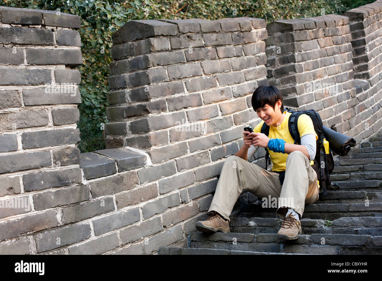Young people using cellphone on the Great Wall Stock Photo - Alamy