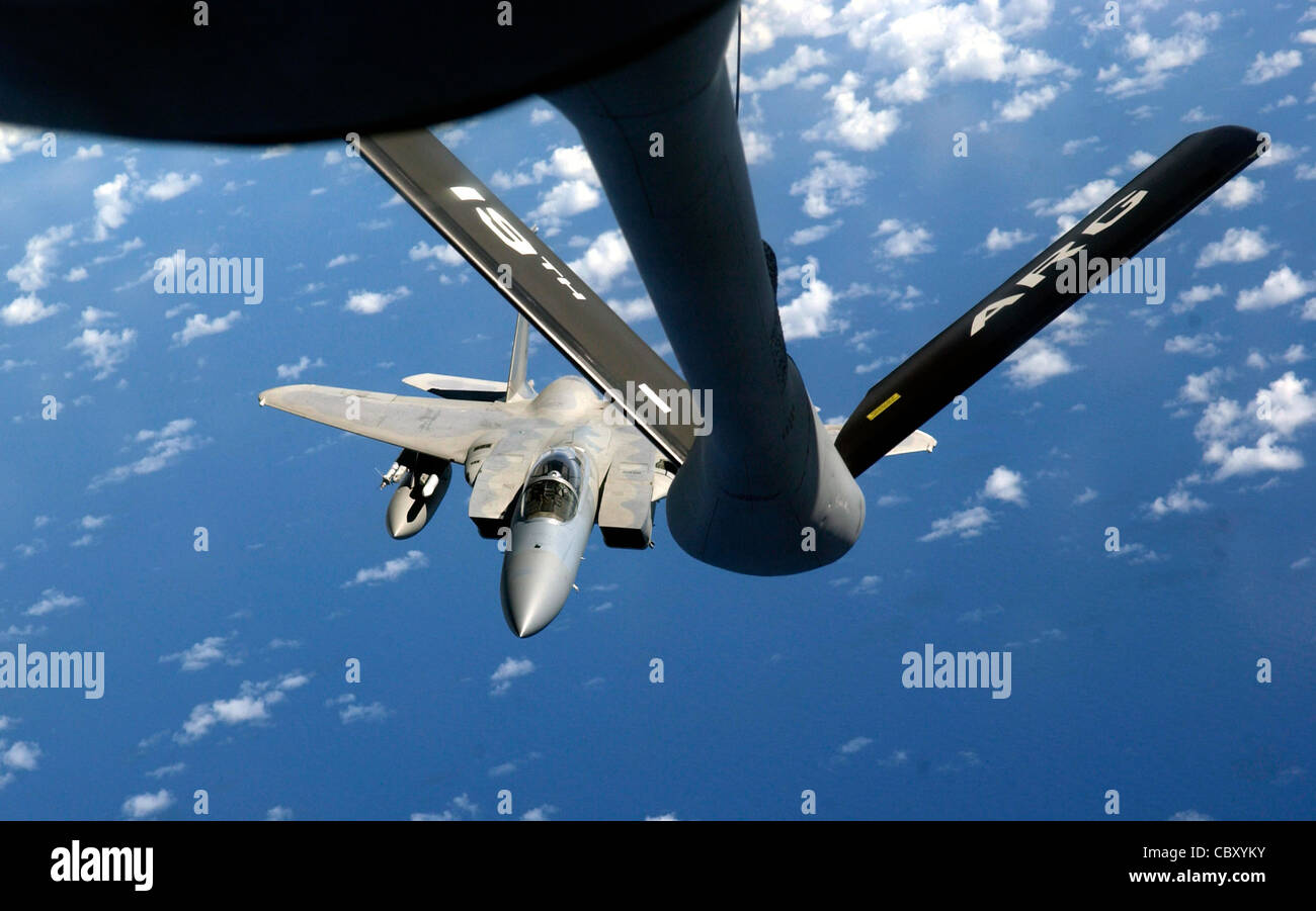 An F-15 Eagle flies toward the boom of a KC-135 Stratotanker during ...