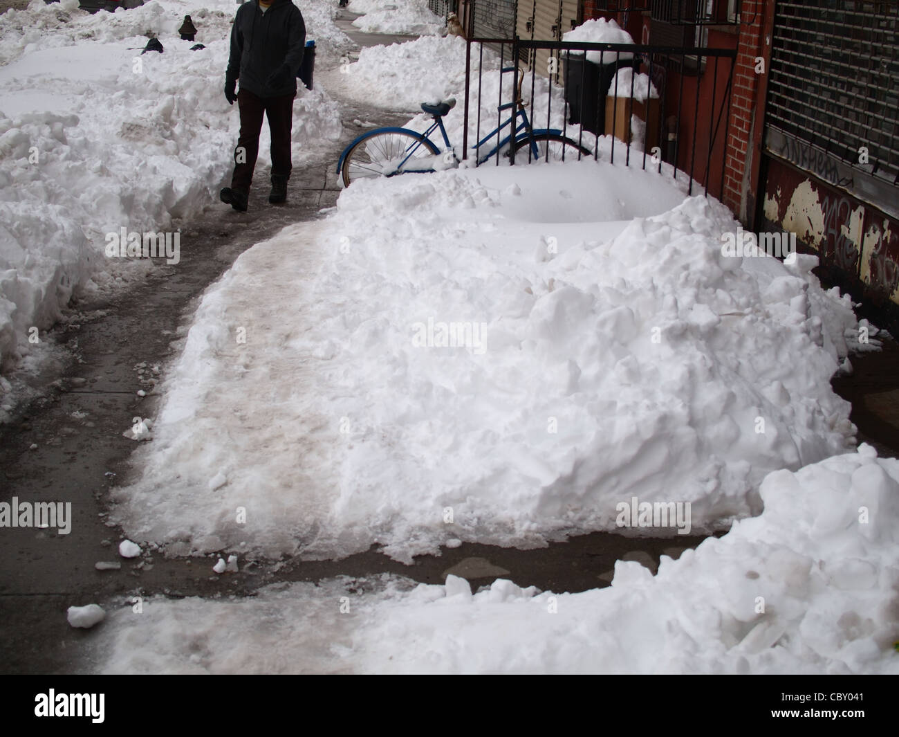 Man walking on street after snow storm, Brooklyn, New York Stock Photo ...