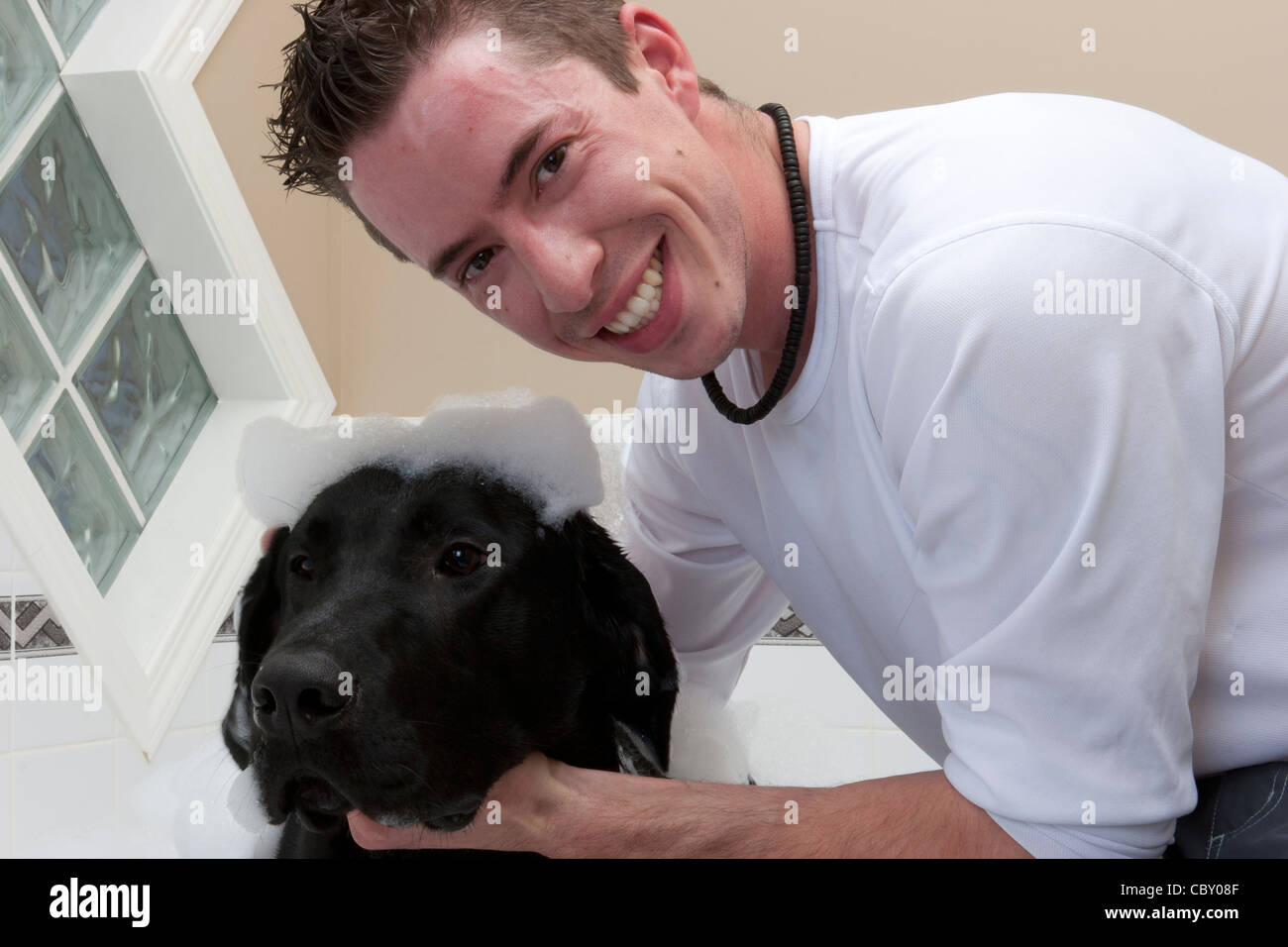 Man washing his dog hi-res stock photography and images - Alamy