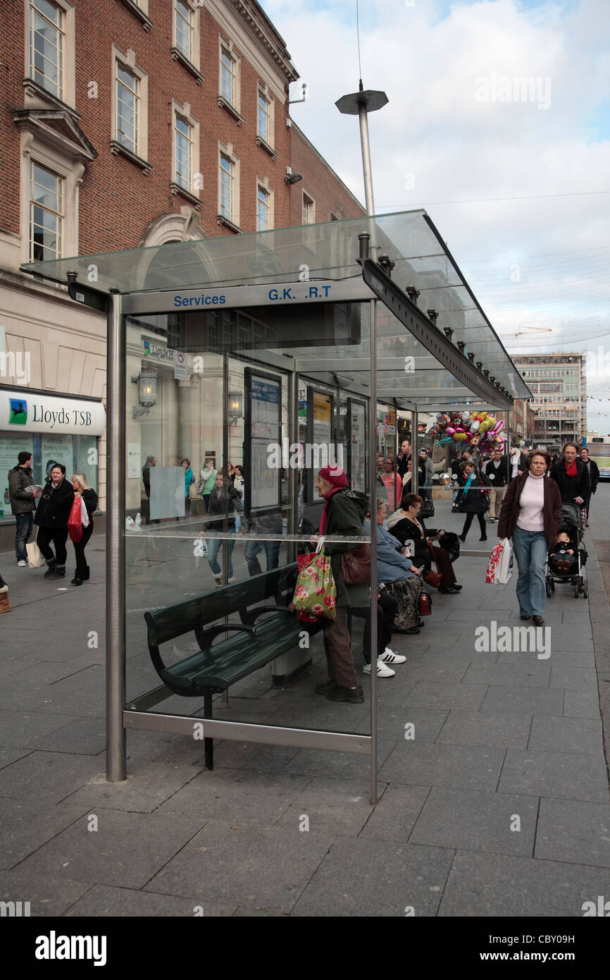 People waiting for a Bus queue queuing for stops and buses in Exeter ...