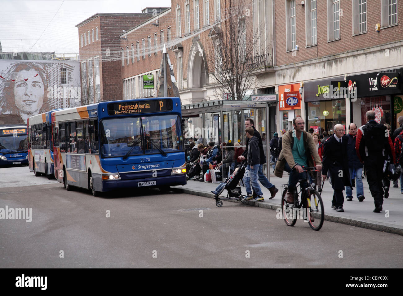 Bus stops and buses in Exeter High St UK Stock Photo - Alamy