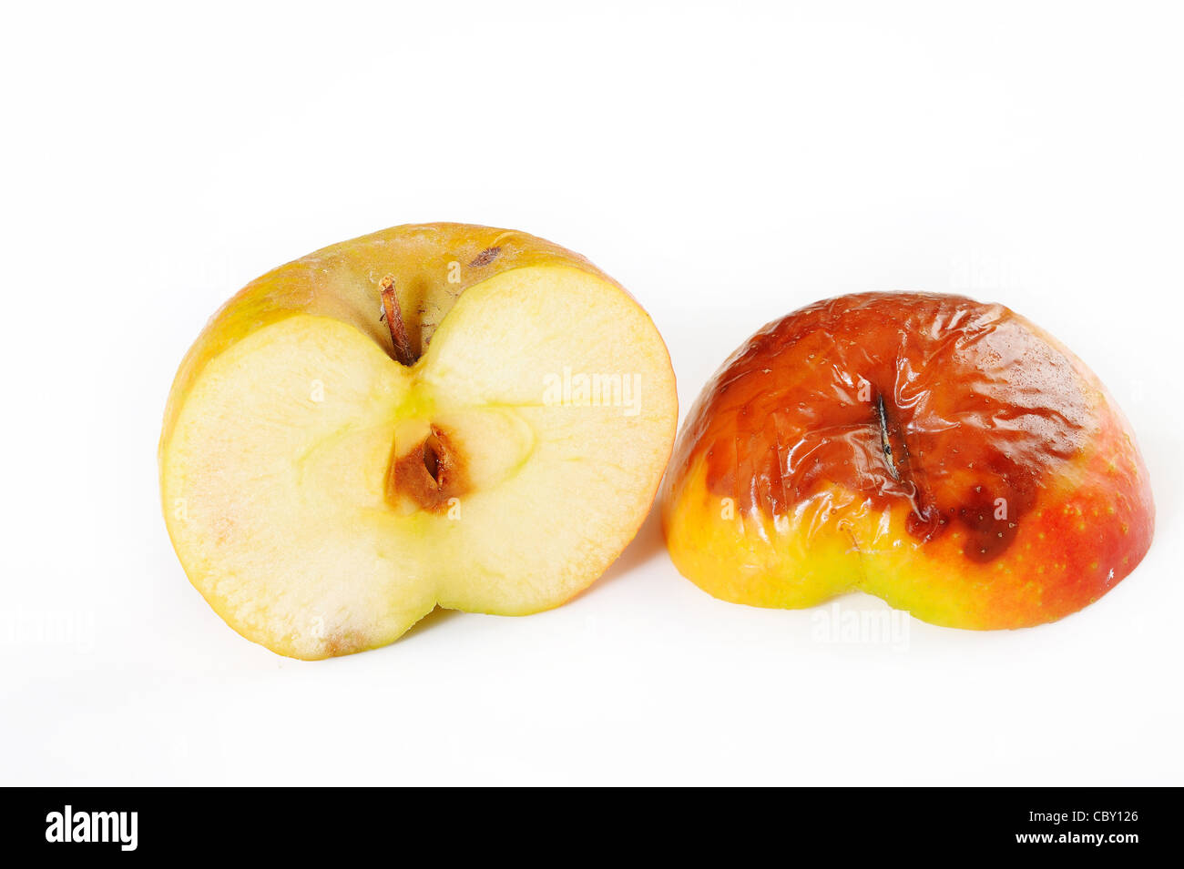 rotten apple with cut section on white background Stock Photo - Alamy