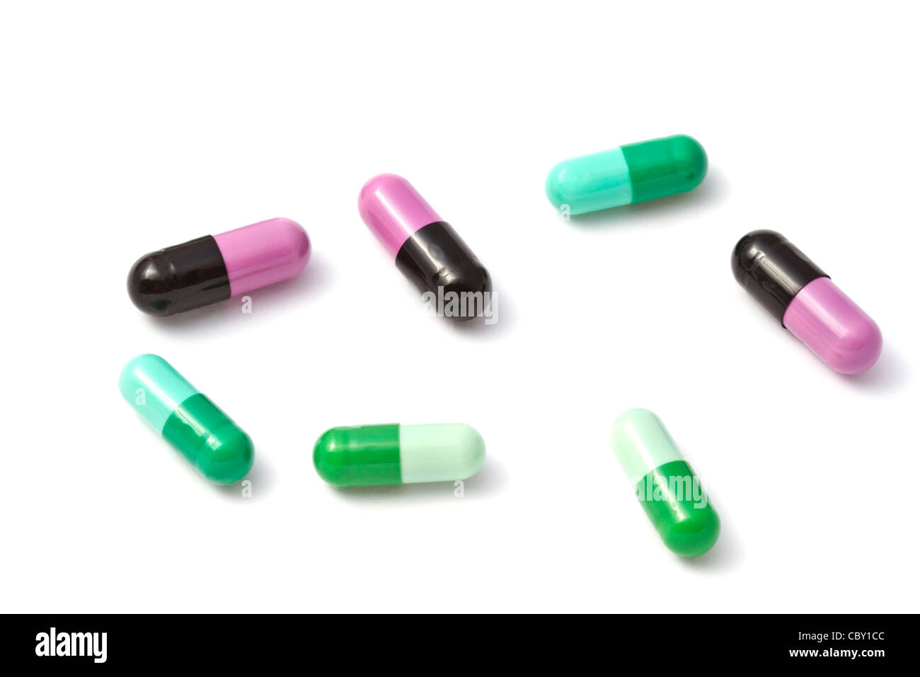 Colorful capsules closeup on white background Stock Photo - Alamy