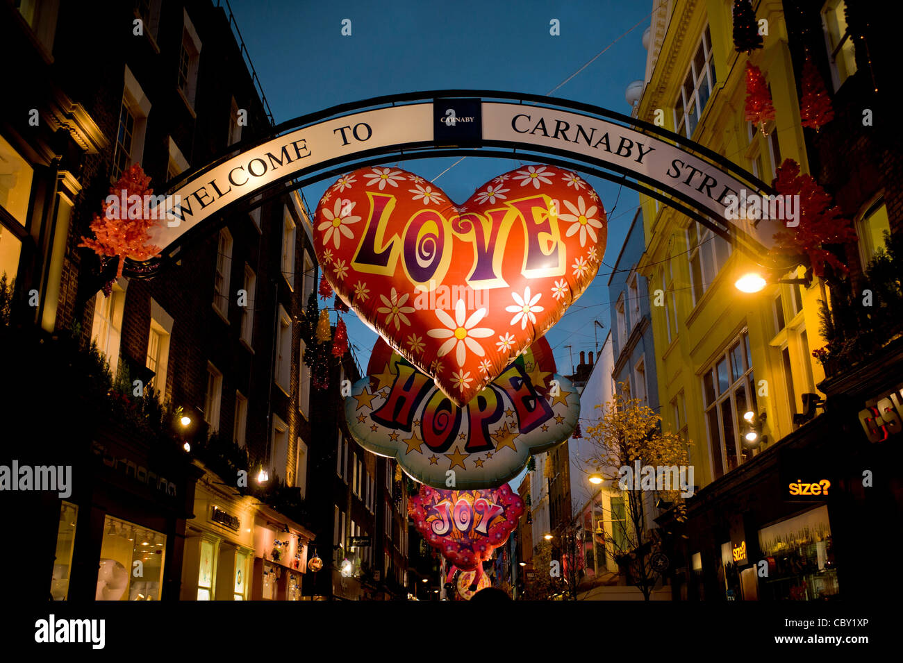 Inflatable hearts with the words love, hope, and joy printed on them ...