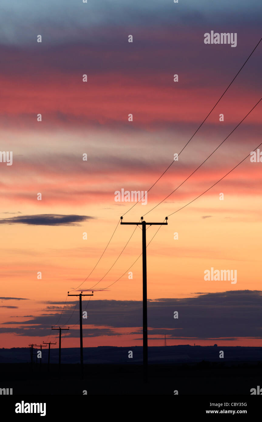 Power poles against sunset hi-res stock photography and images - Alamy