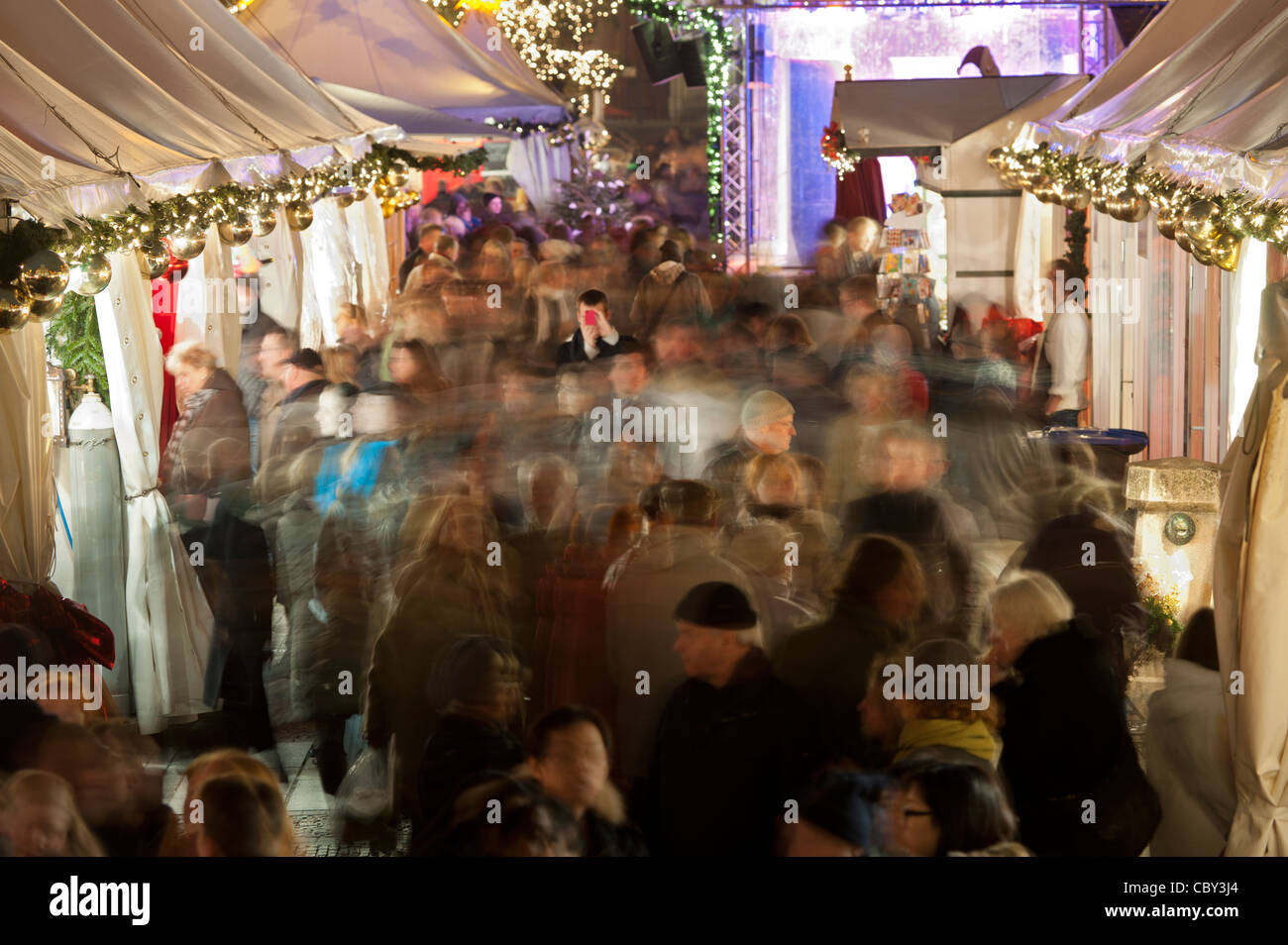 Night view of busy traditional German Christmas Market in ...