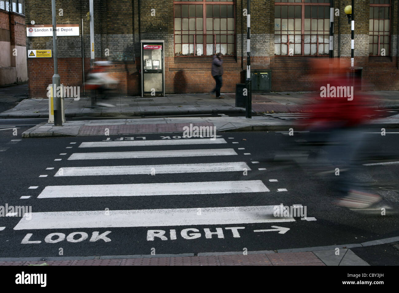 a view of a zebra crossing in London with the blurred outline of a ...