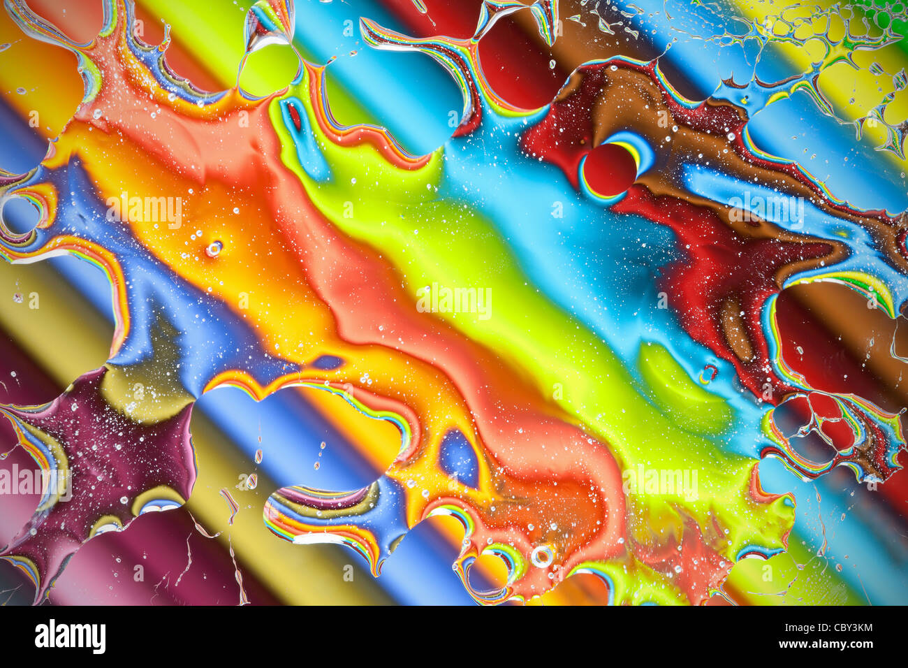 Colourful crayons seen through a water splash Stock Photo - Alamy