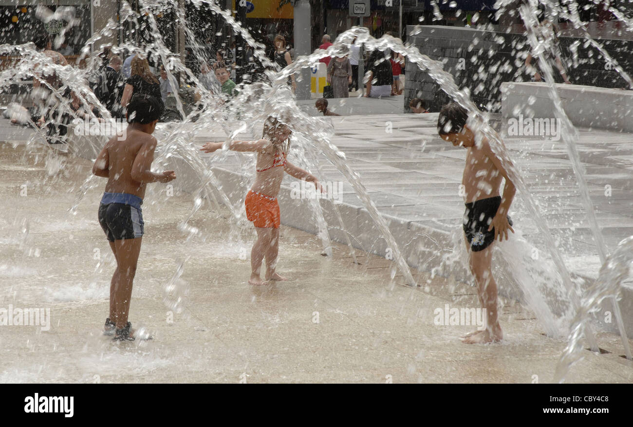 Children playing in water fountains during a hot day in Nottingham, UK ...