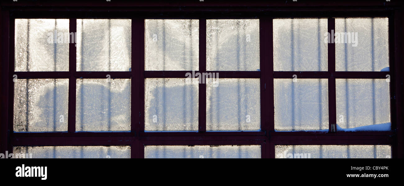 Light shining through icy windows at Winter Stock Photo - Alamy